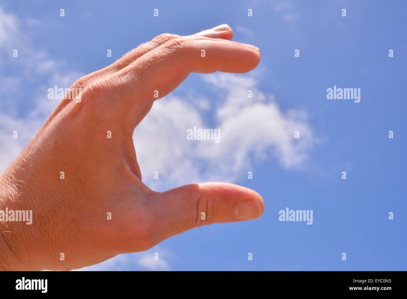 Hand over a Cloudy Sky Stock Photo - Alamy