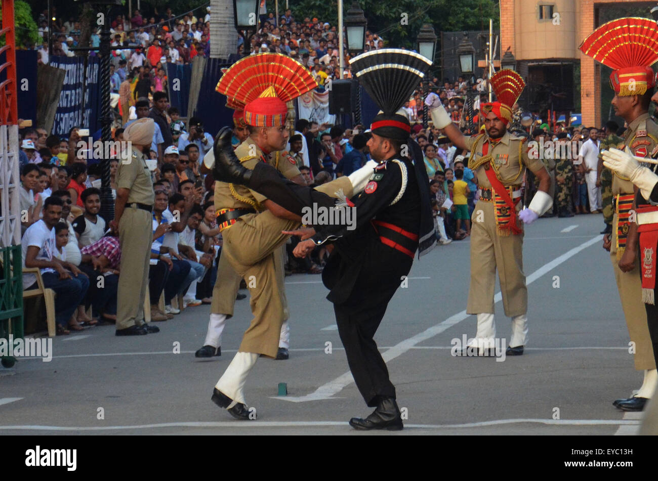 Pakistani rangers (wearing black uniforms) and Indian Border Security ...