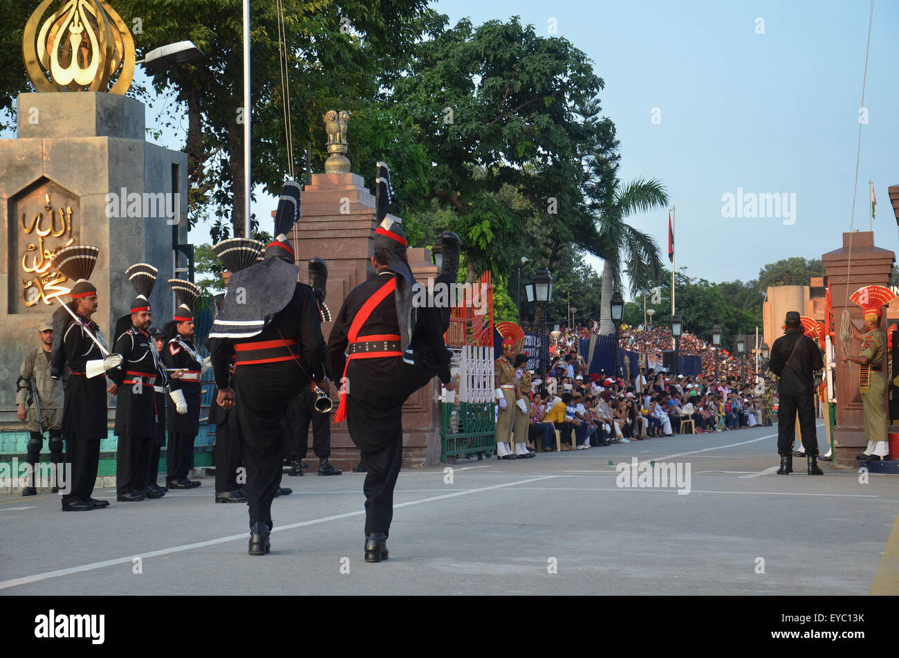 Pakistani rangers (wearing black uniforms) and Indian Border Security ...