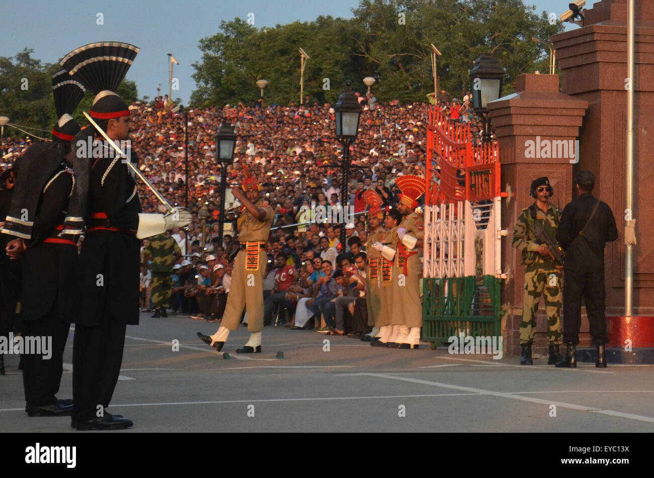 Pakistani rangers (wearing black uniforms) and Indian Border Security ...
