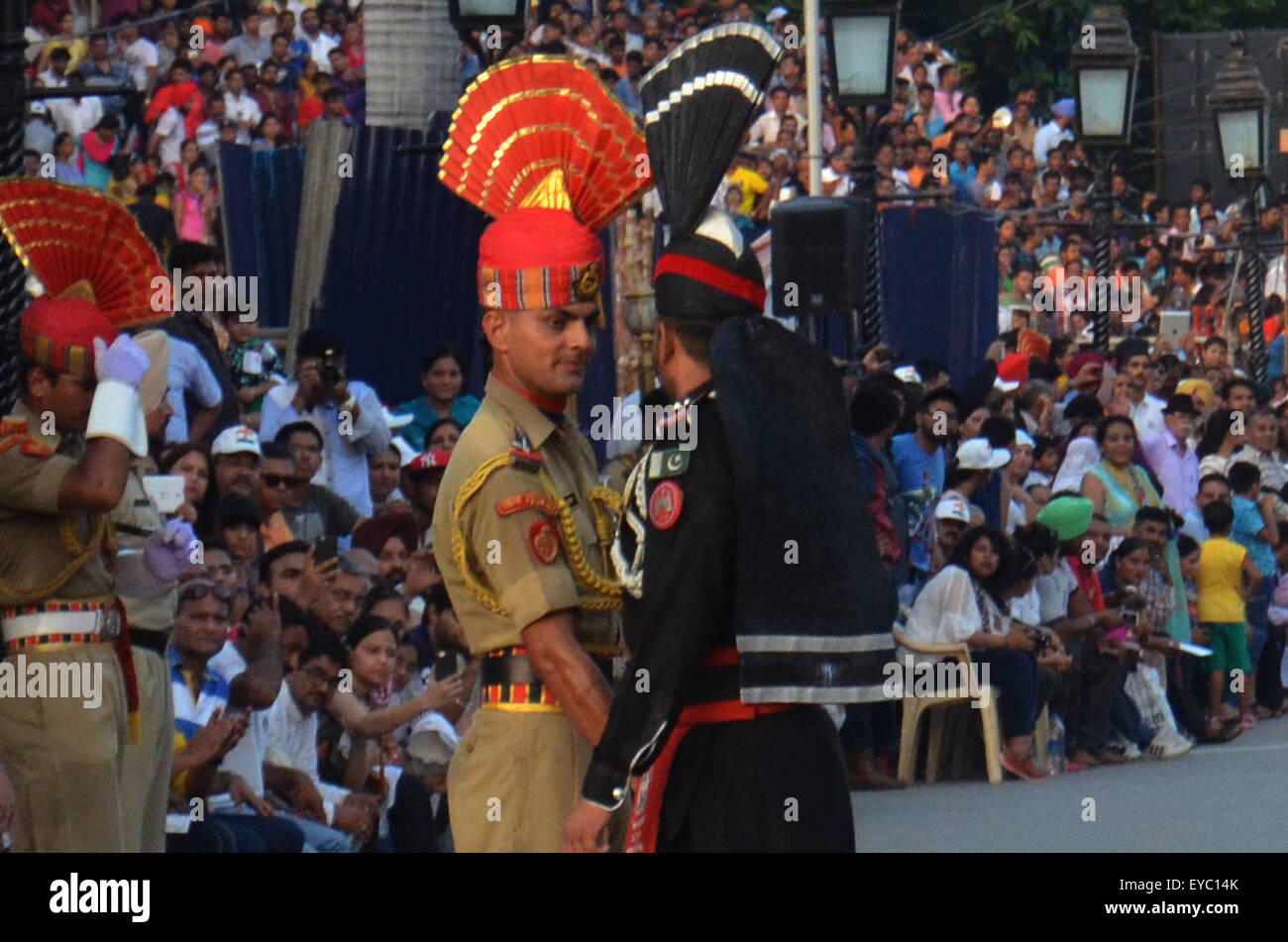 Pakistani rangers (wearing black uniforms) and Indian Border Security ...