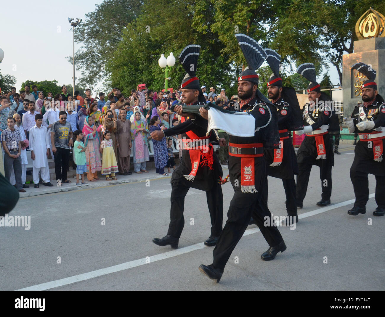 Pakistani rangers (wearing black uniforms) and Indian Border Security ...