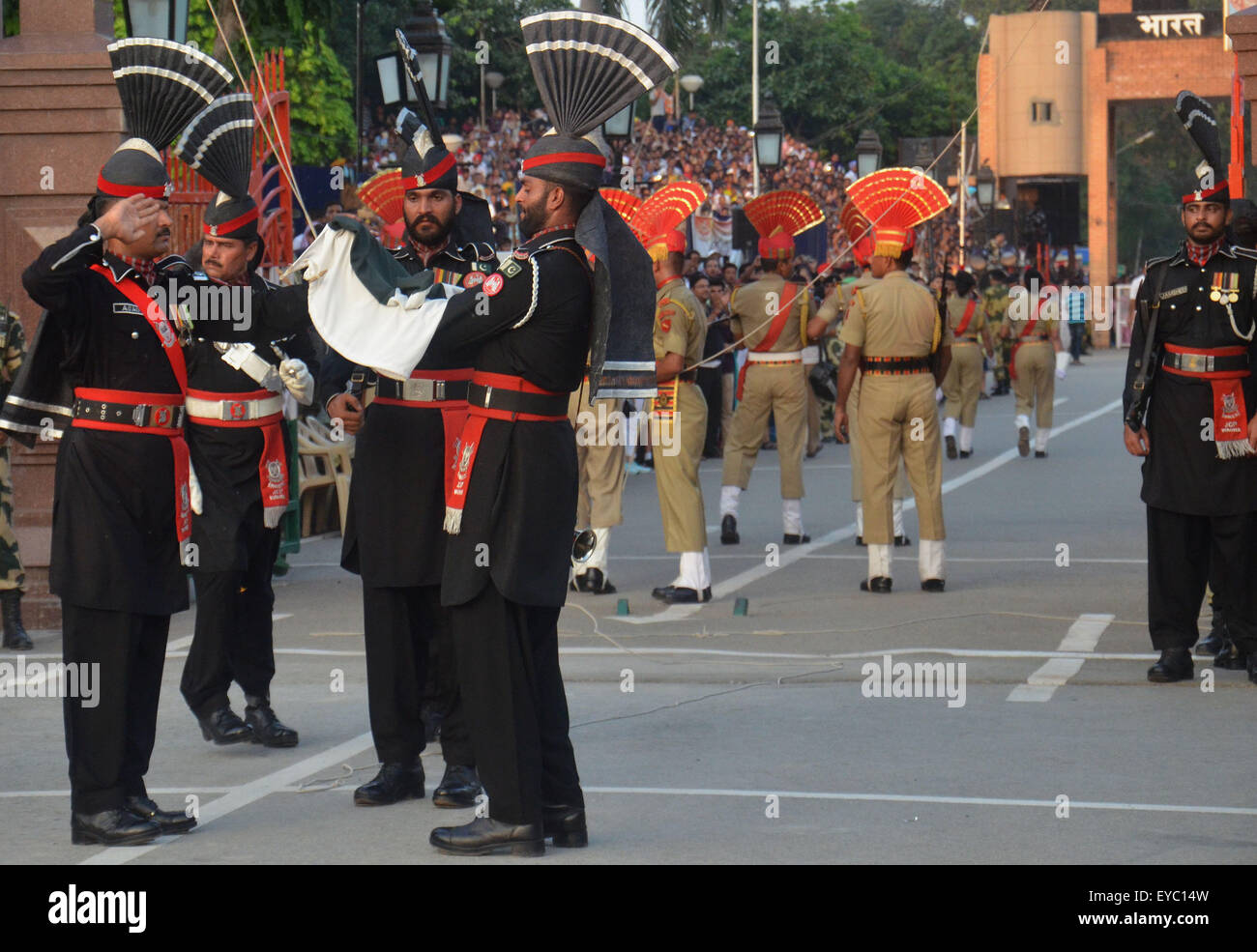 Pakistani rangers (wearing black uniforms) and Indian Border Security ...