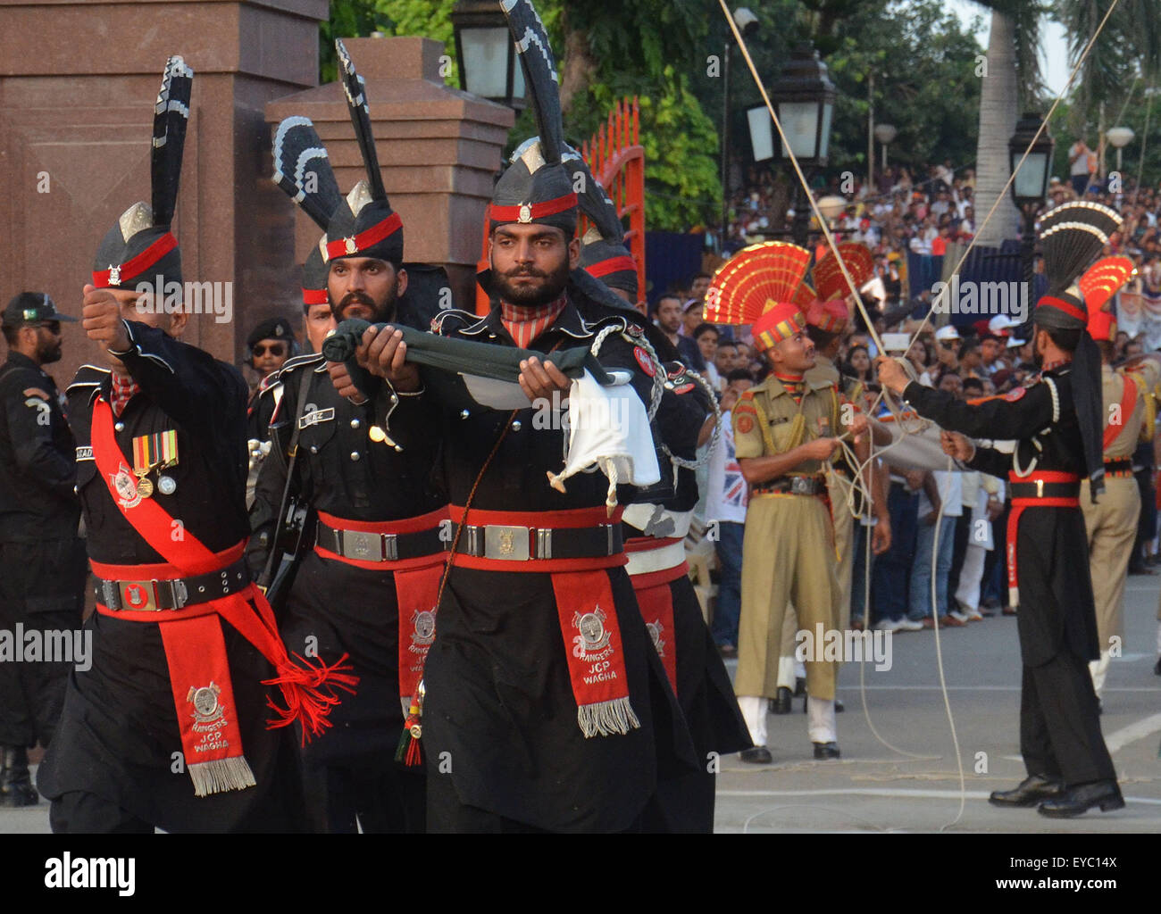 Pakistani rangers (wearing black uniforms) and Indian Border Security ...