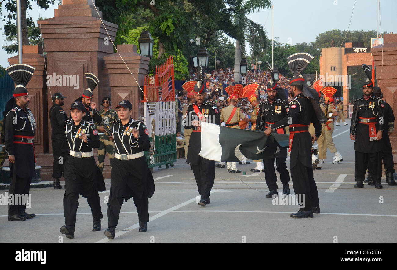 Pakistani rangers (wearing black uniforms) and Indian Border Security ...