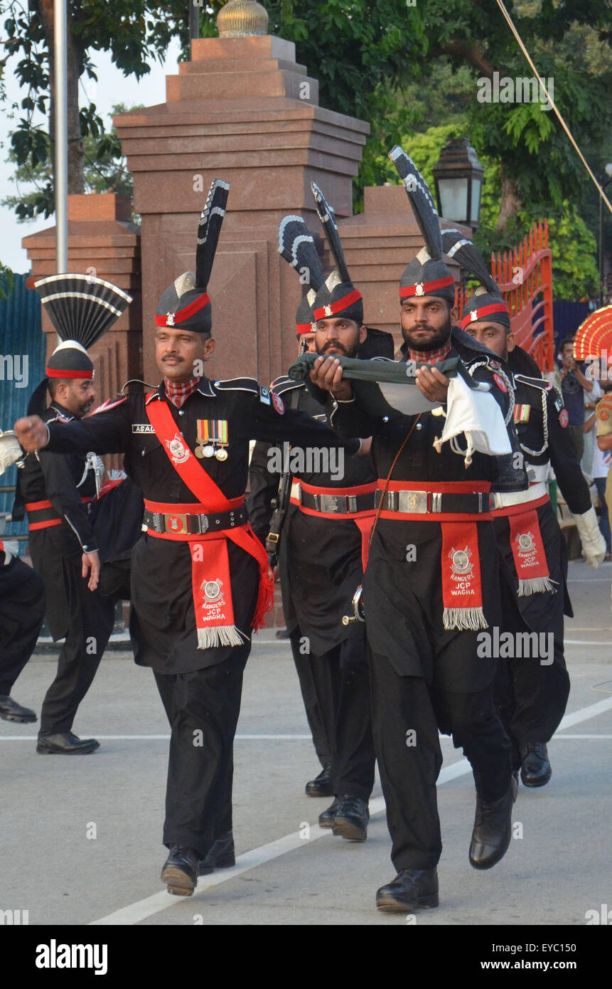 Pakistani rangers (wearing black uniforms) and Indian Border Security ...