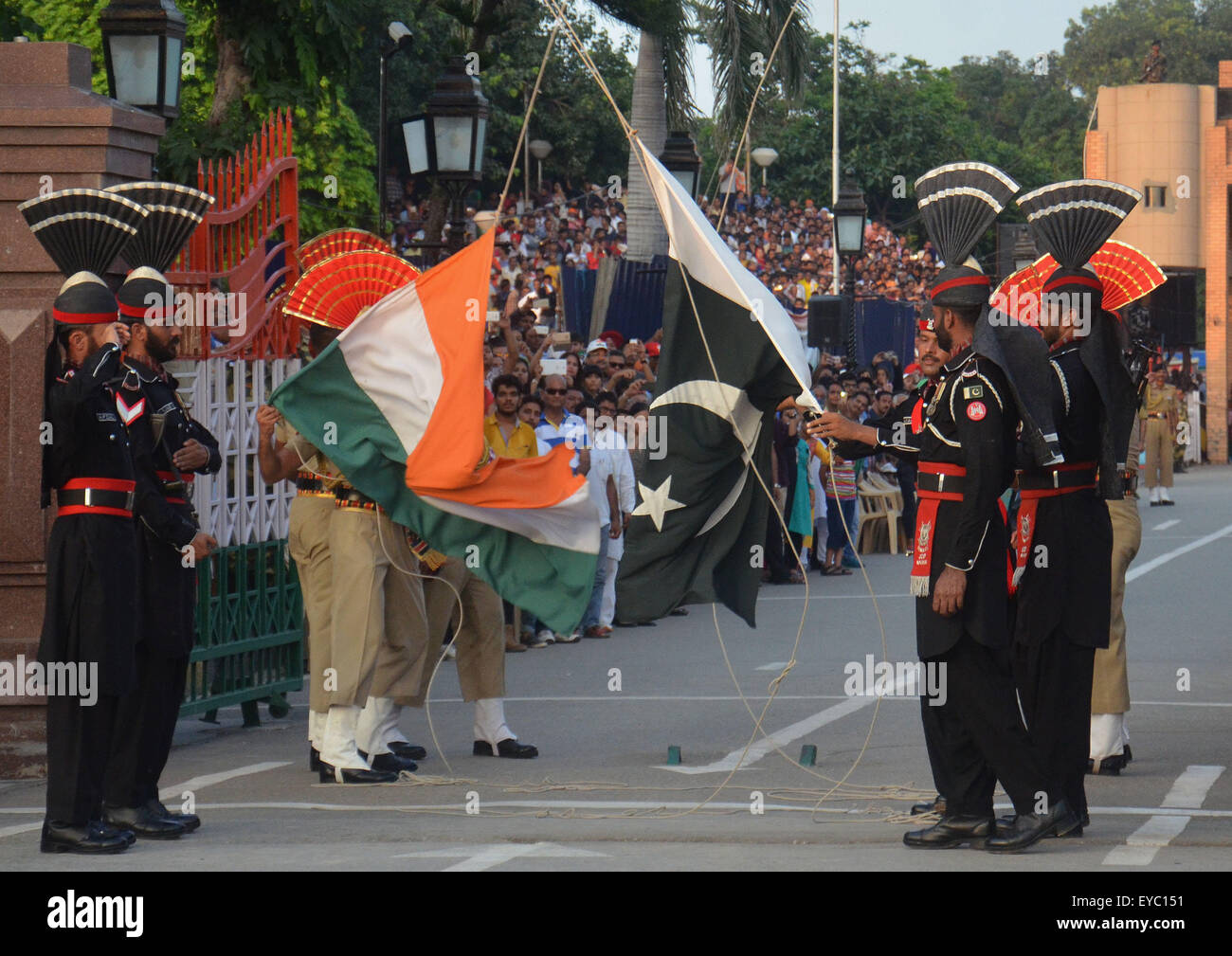 Pakistani rangers (wearing black uniforms) and Indian Border Security ...
