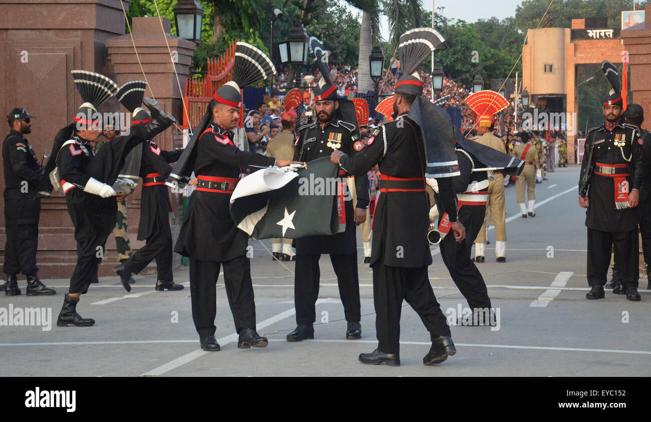 Pakistani rangers (wearing black uniforms) and Indian Border Security ...