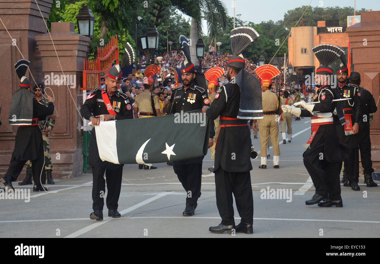 Pakistani rangers (wearing black uniforms) and Indian Border Security ...