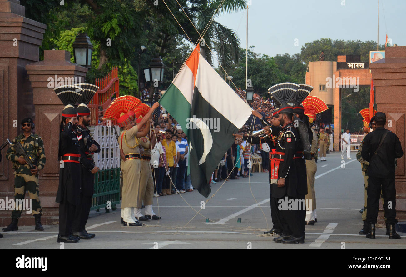 Pakistani rangers (wearing black uniforms) and Indian Border Security ...