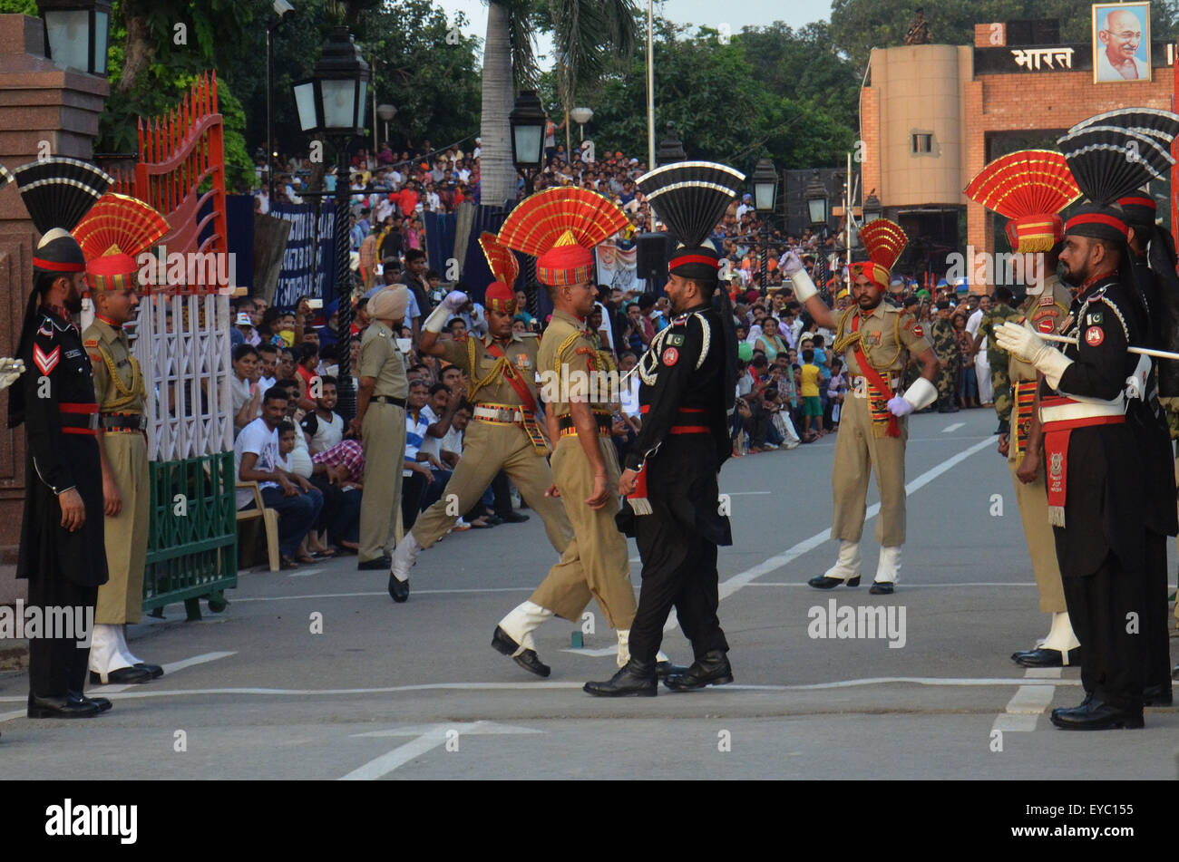 Pakistani rangers (wearing black uniforms) and Indian Border Security ...
