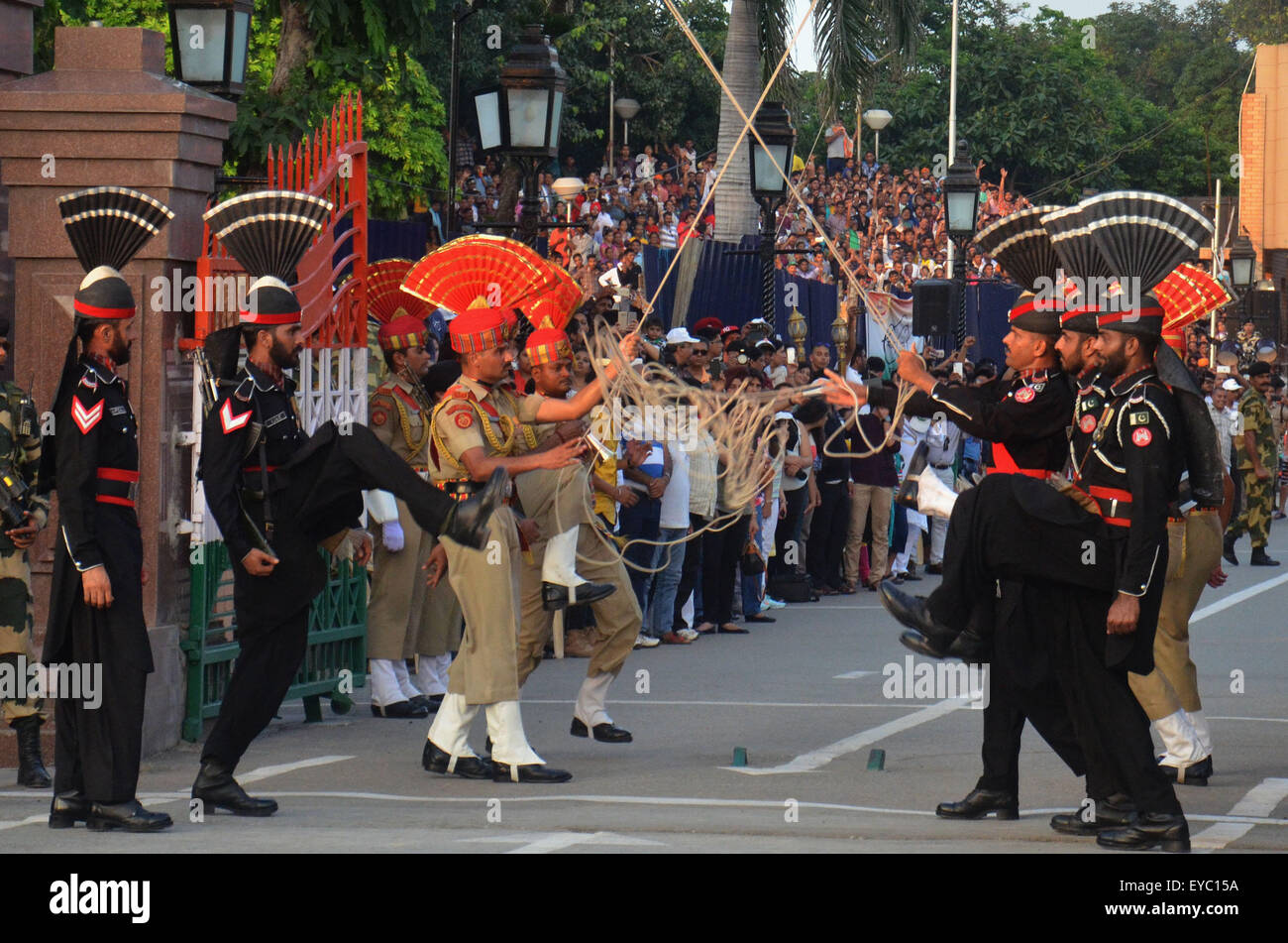 Pakistani rangers (wearing black uniforms) and Indian Border Security ...