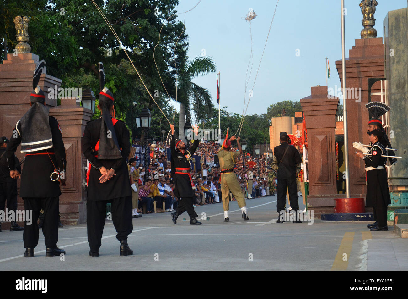 Pakistani rangers (wearing black uniforms) and Indian Border Security ...