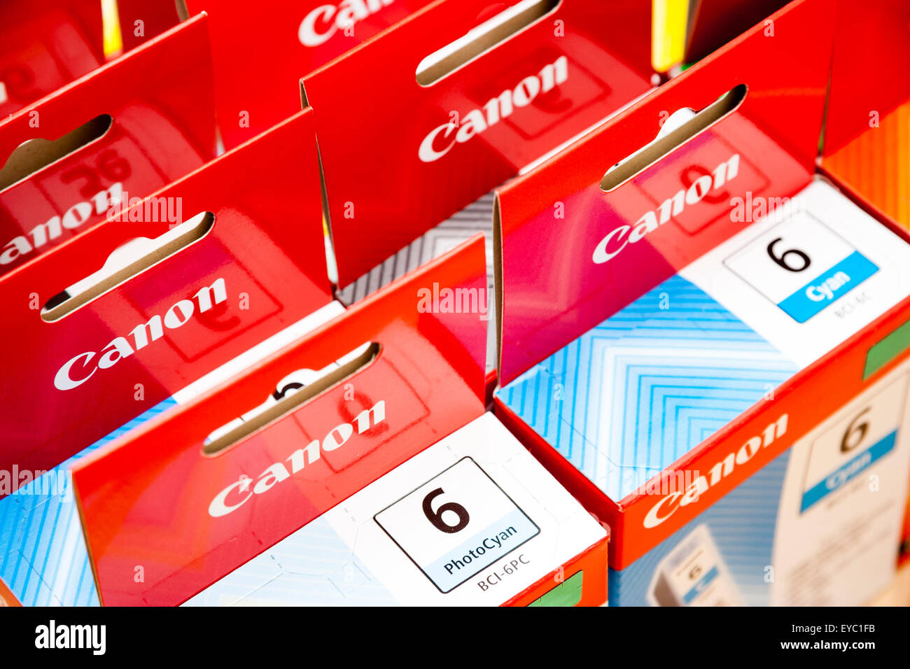 Canon printer ink boxes each housing a color ink cartridge. Looking ...