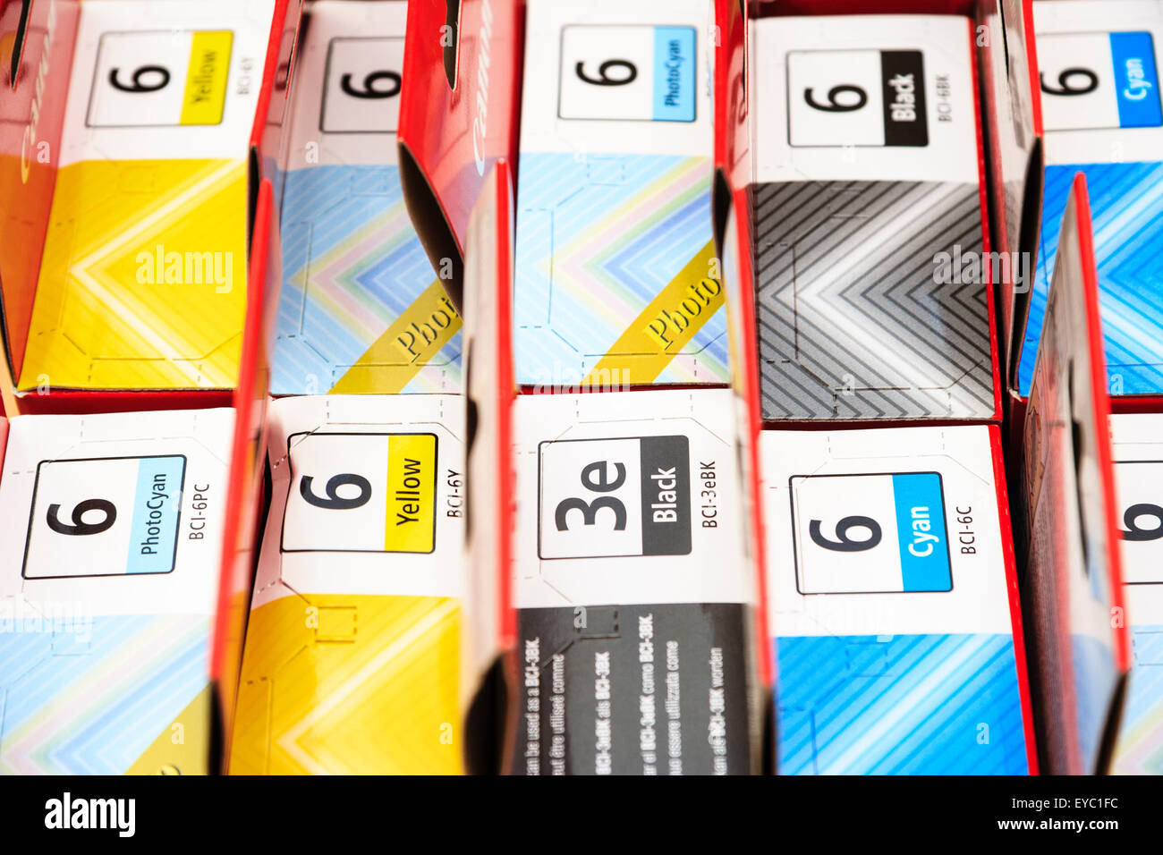 Canon printer ink boxes each housing a color ink cartridge. Looking ...