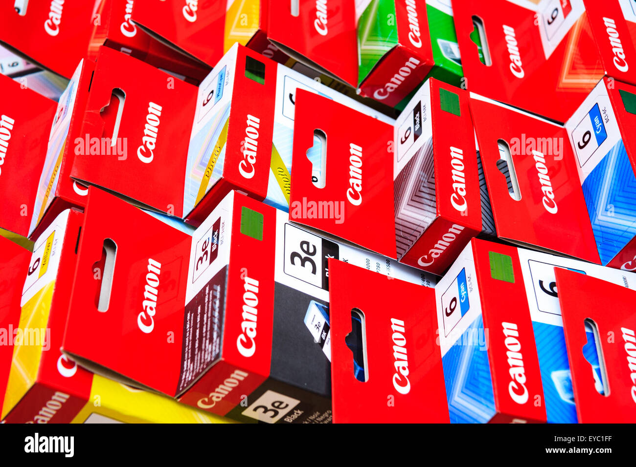 Canon printer ink boxes each housing a color ink cartridge. Looking ...