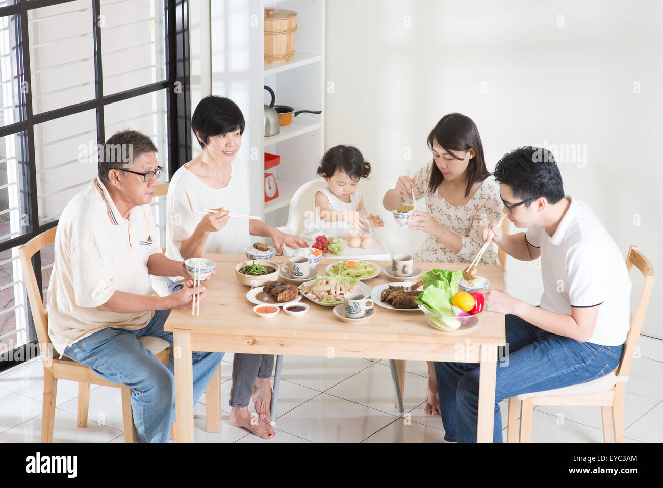 Happy Asian Chinese multi generations family dining at home Stock Photo ...