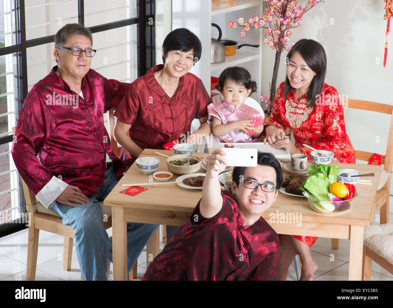 Chinese New Year celebration, reunion dinner. Happy Asian Chinese multi ...