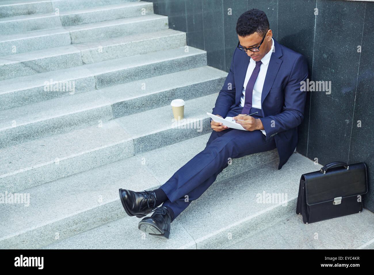 Successful businessman making notes hi-res stock photography and images ...
