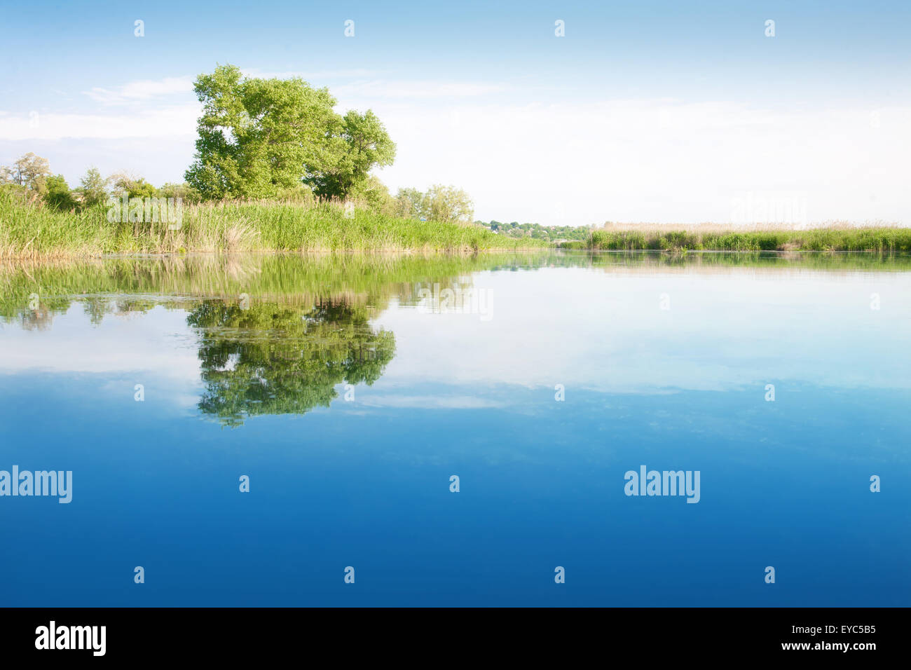 River landscape with sky reflection in water Stock Photo - Alamy