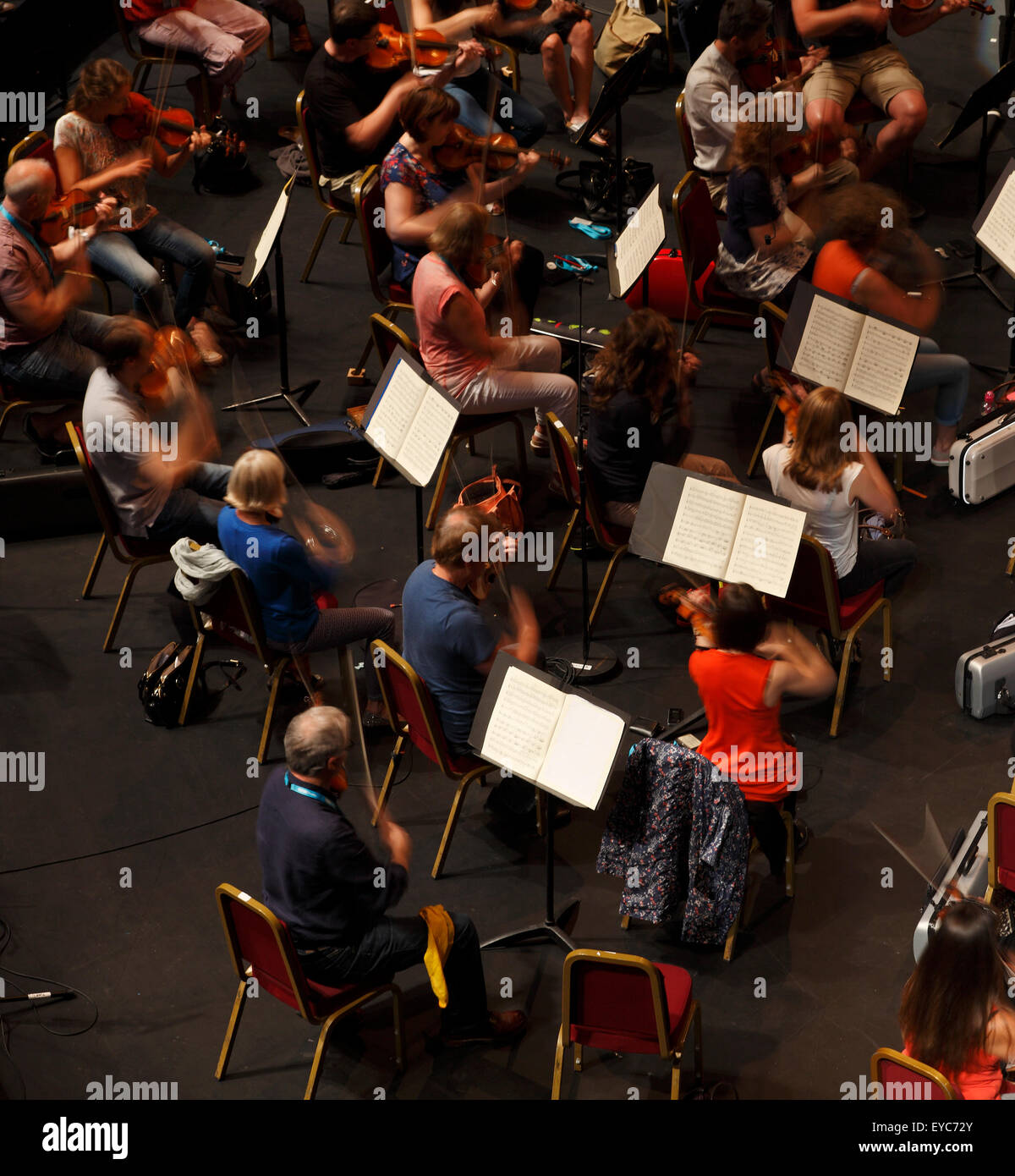 violin section in an orchestra in rehearsal Stock Photo - Alamy