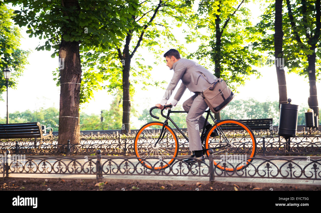 Businessman biking hi-res stock photography and images - Alamy