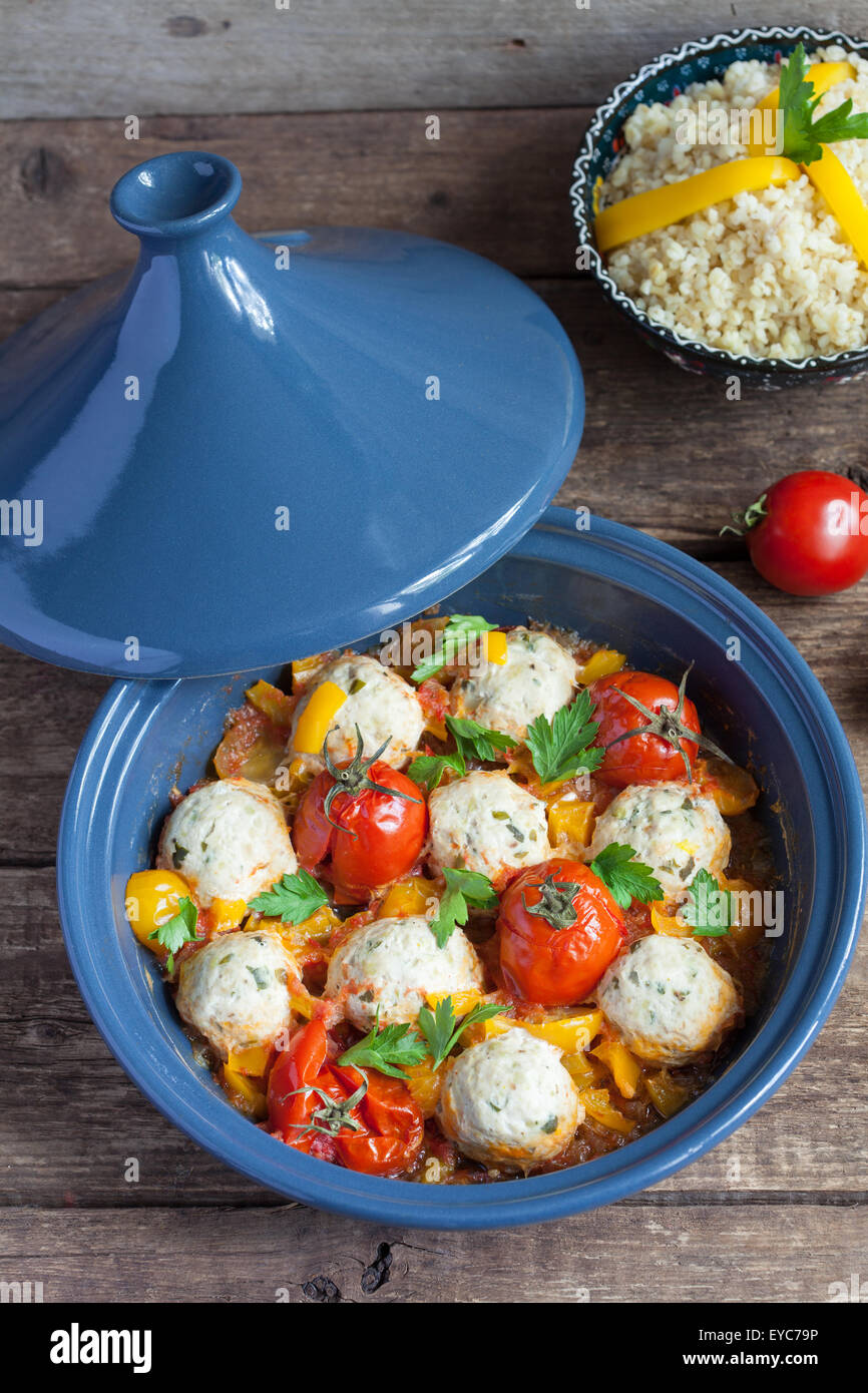 Moroccan tagine with chicken kefta (meatballs), red and yellow tomatoes ...