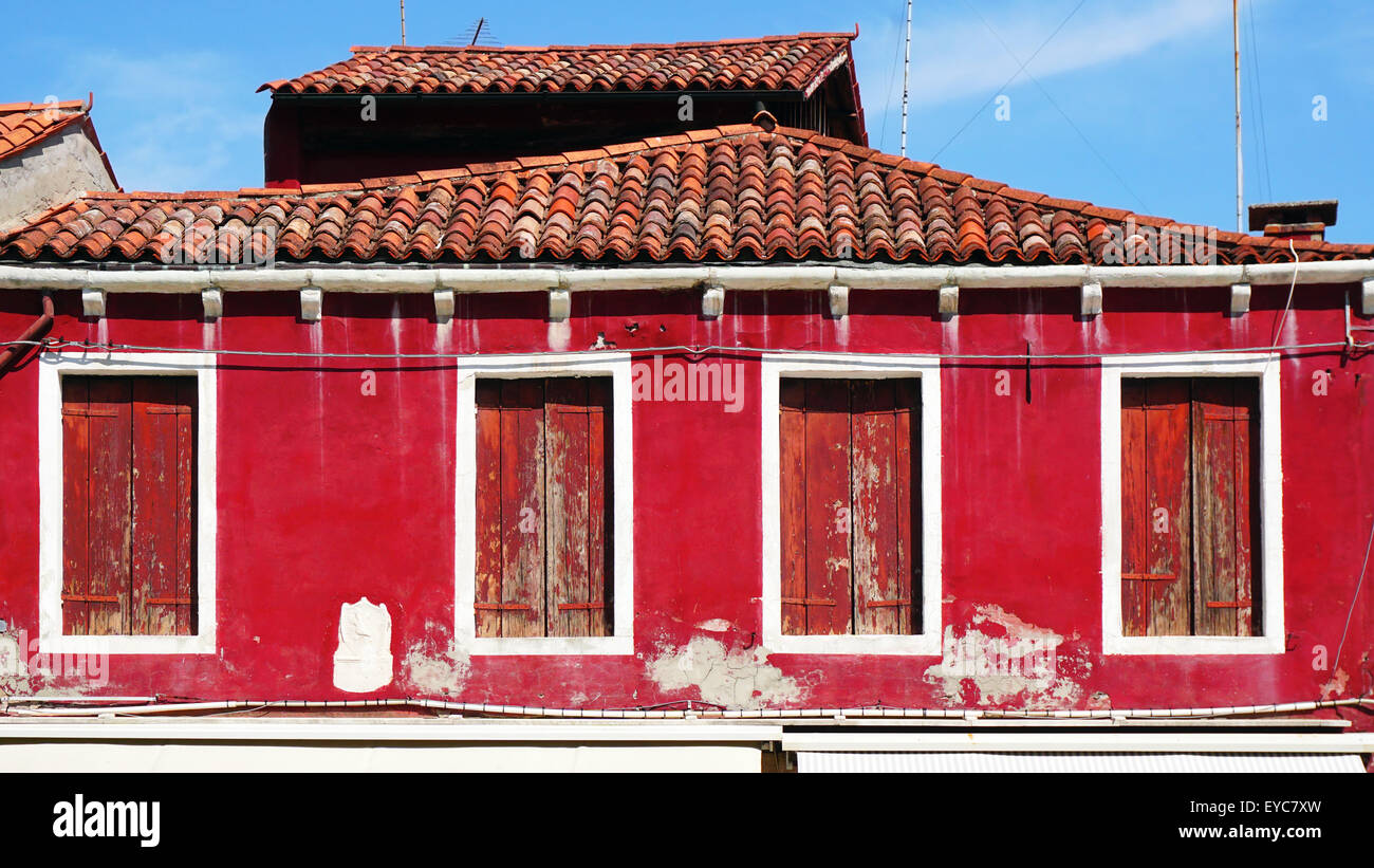 old window house and roof with red color wall architecture in Murano ...