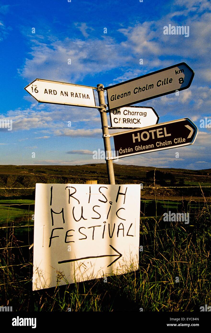 Road signs sign for an irish music festival on fence hi-res stock ...