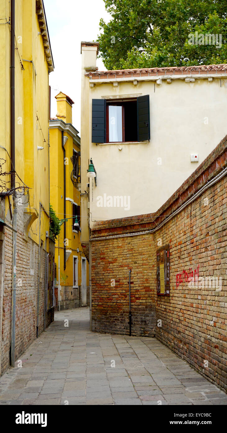 Alley with ancient brick fence building in Venice, Italy Stock Photo ...