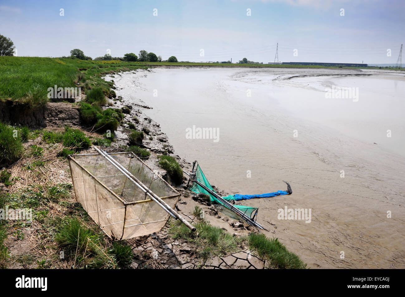 A confiscated oversized elver net and an illegal flow net (behind) on ...