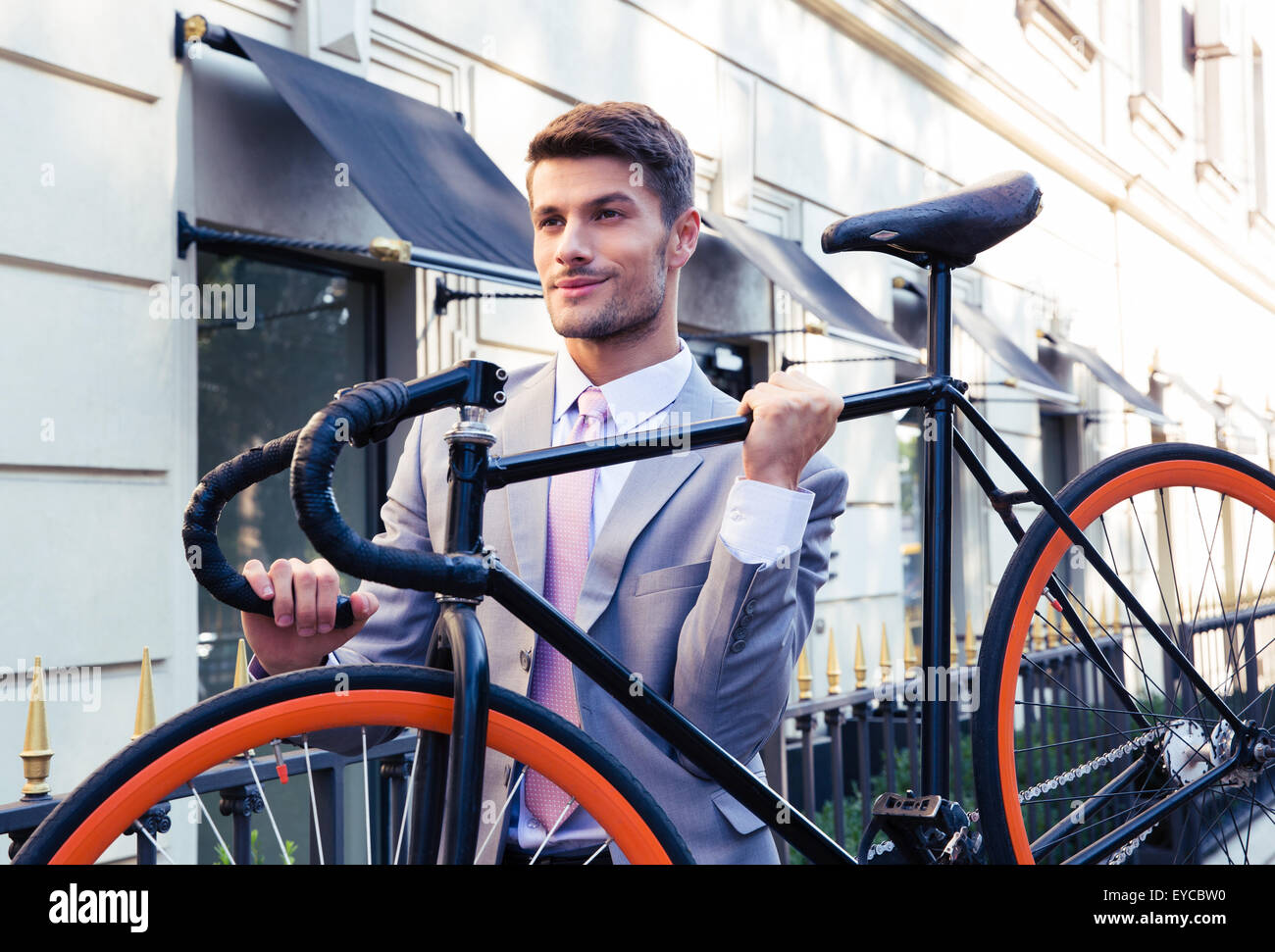 Young handsome businessman bike hi-res stock photography and images - Alamy