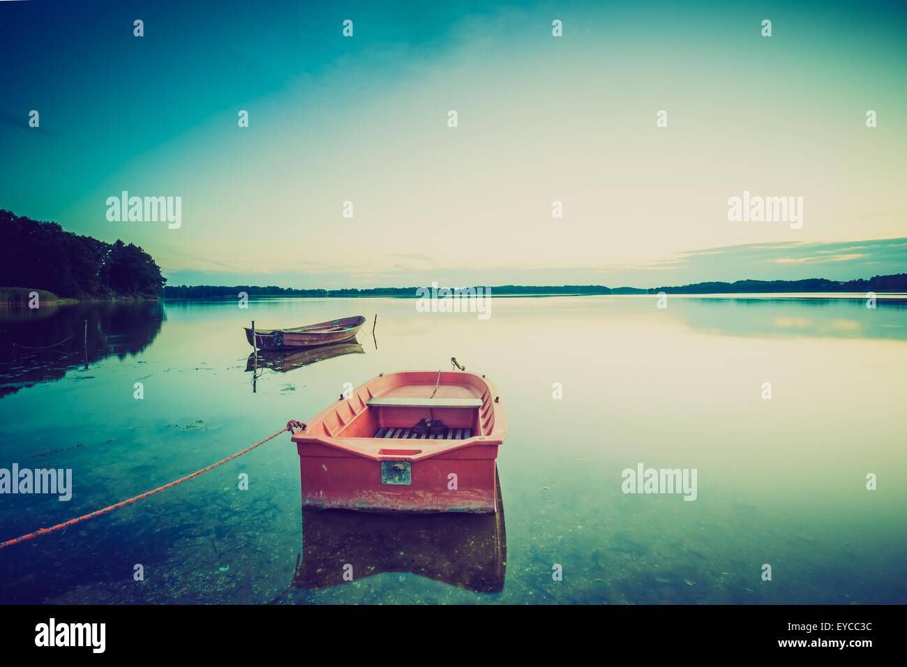 Vintage photo of beautiful lake sunset. Polish lake in Mazury lake ...