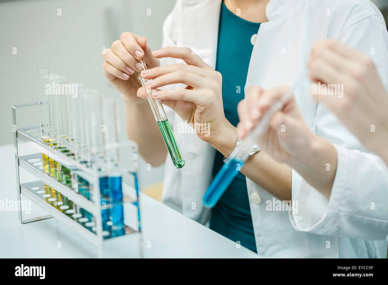 Lab worker working with test tubes Stock Photo - Alamy