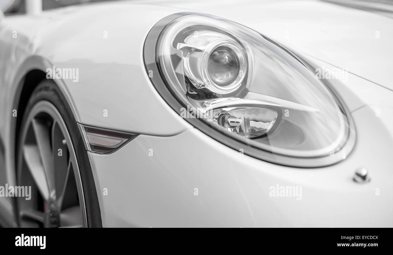 Close-up view of white sports car headlight Stock Photo - Alamy