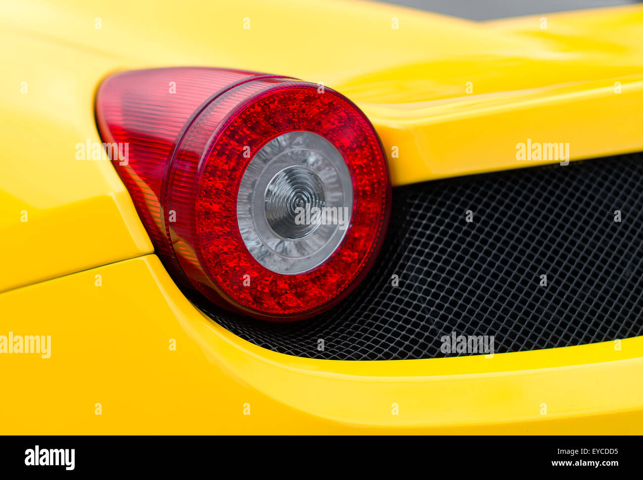 Close-up view of yellow sports car rear light Stock Photo - Alamy