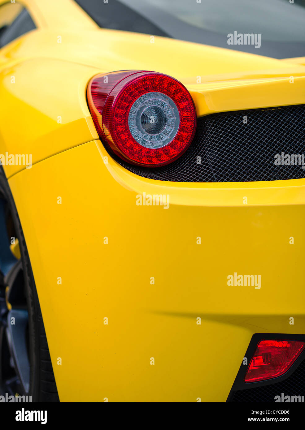 Close-up view of yellow sports car rear light Stock Photo - Alamy