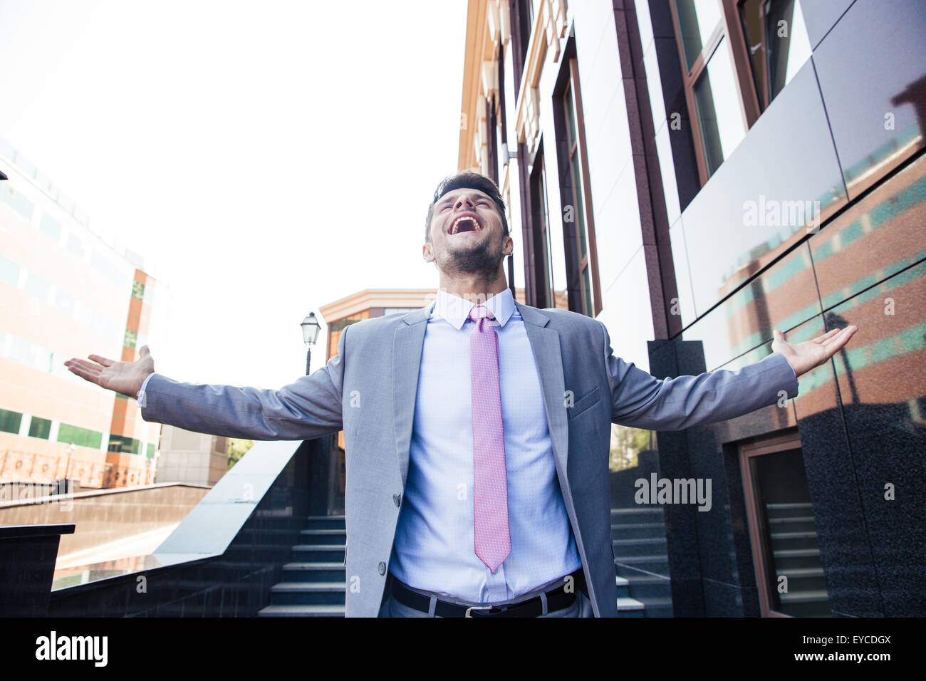 Handsome excited businessman celebrating his success outdoors Stock ...