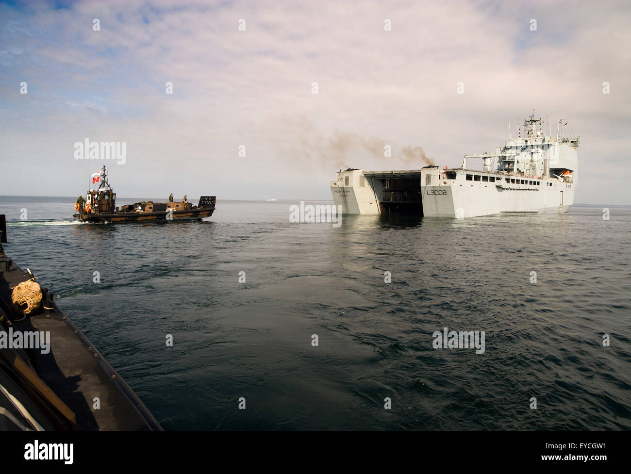 A Royal Marines landing craft (LCVP) approaching the dock of RFA Mounts ...