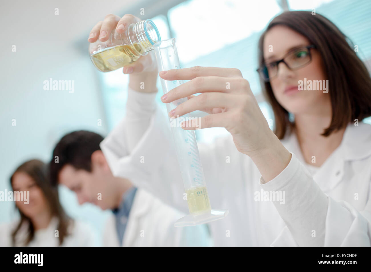 Scientists experimenting in a laboratory Stock Photo - Alamy