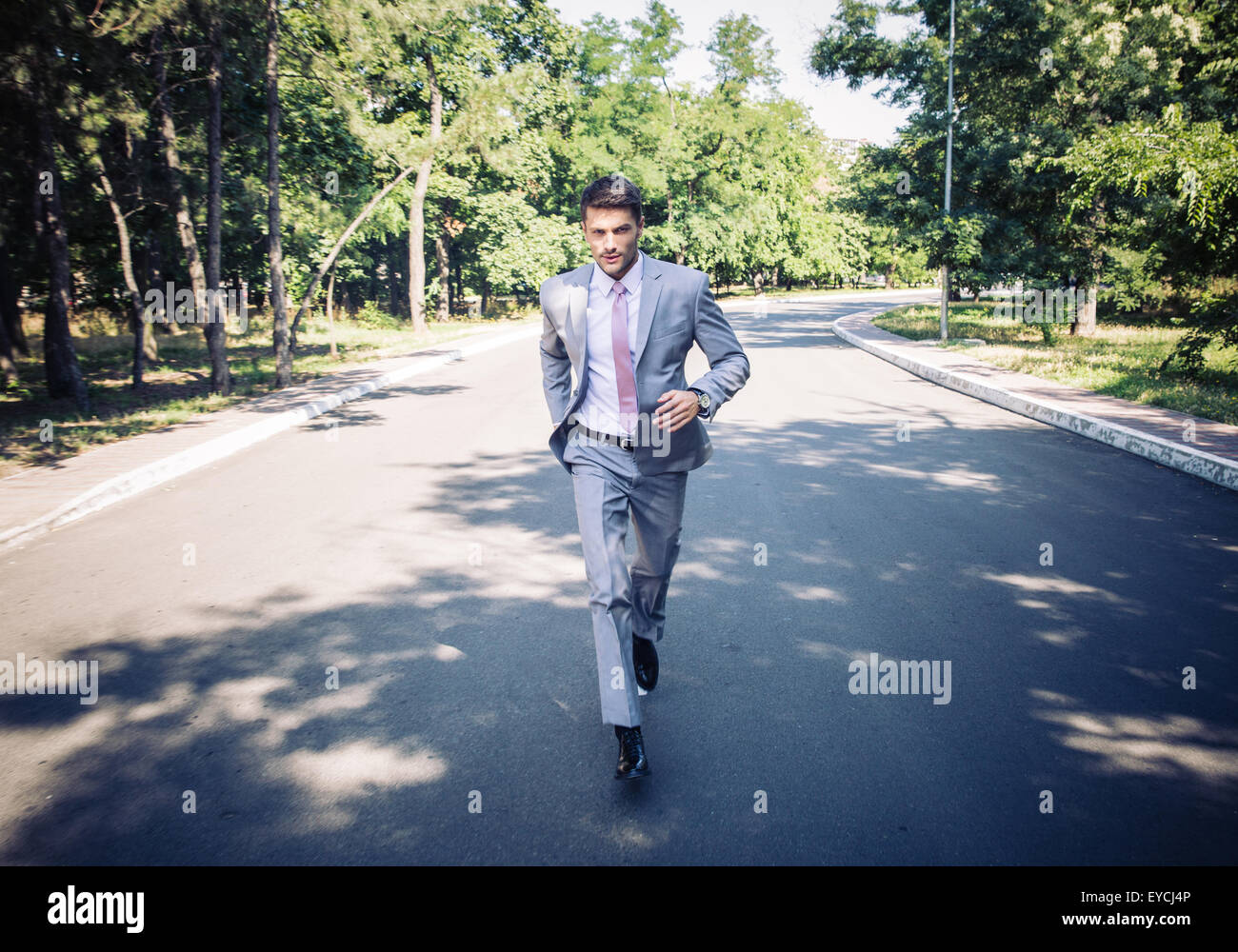 Man running suit street hi-res stock photography and images - Alamy