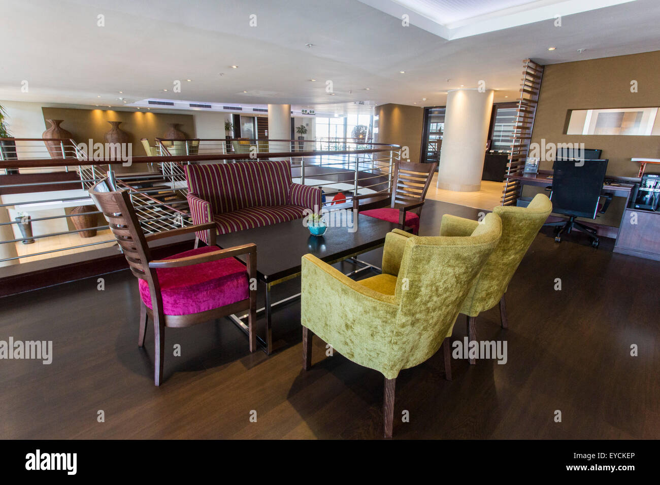 A comfortable lounge with coffee table and chairs in an indoors area of ...