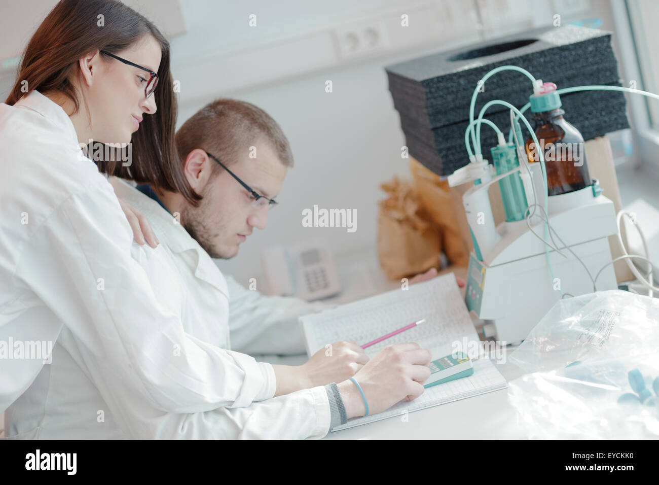 Scientists working in lab Stock Photo - Alamy