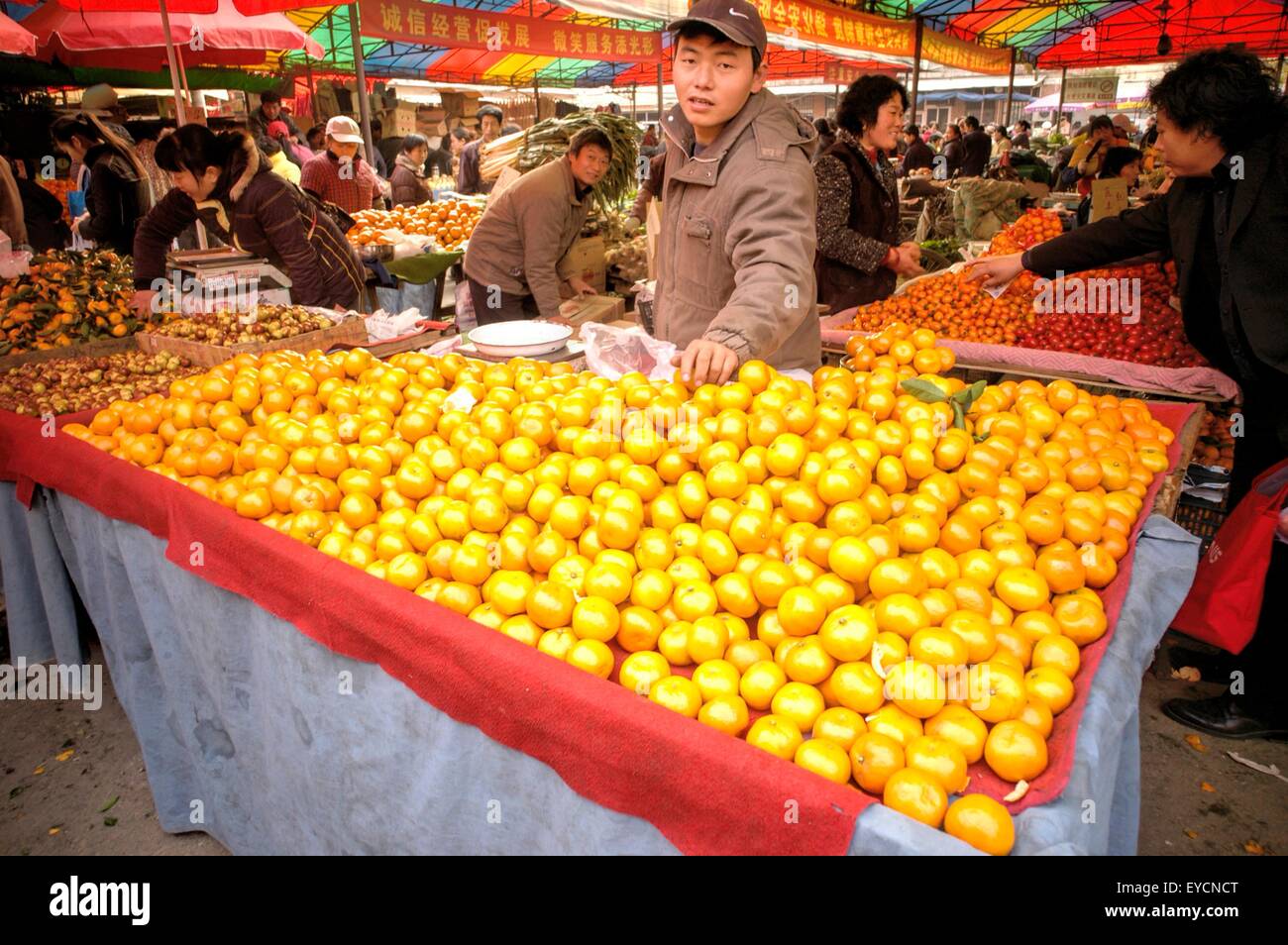 An orange vendor at an open air market in Beijing, China Stock Photo ...