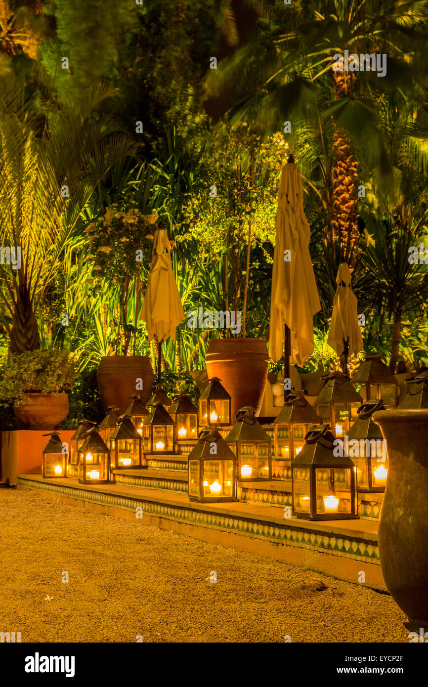 Morocco, Marrakesh, storm lights with lighted candles at garden of La ...