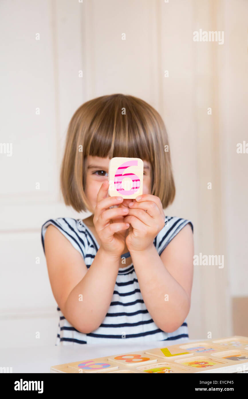 Little girl showing number six Stock Photo - Alamy