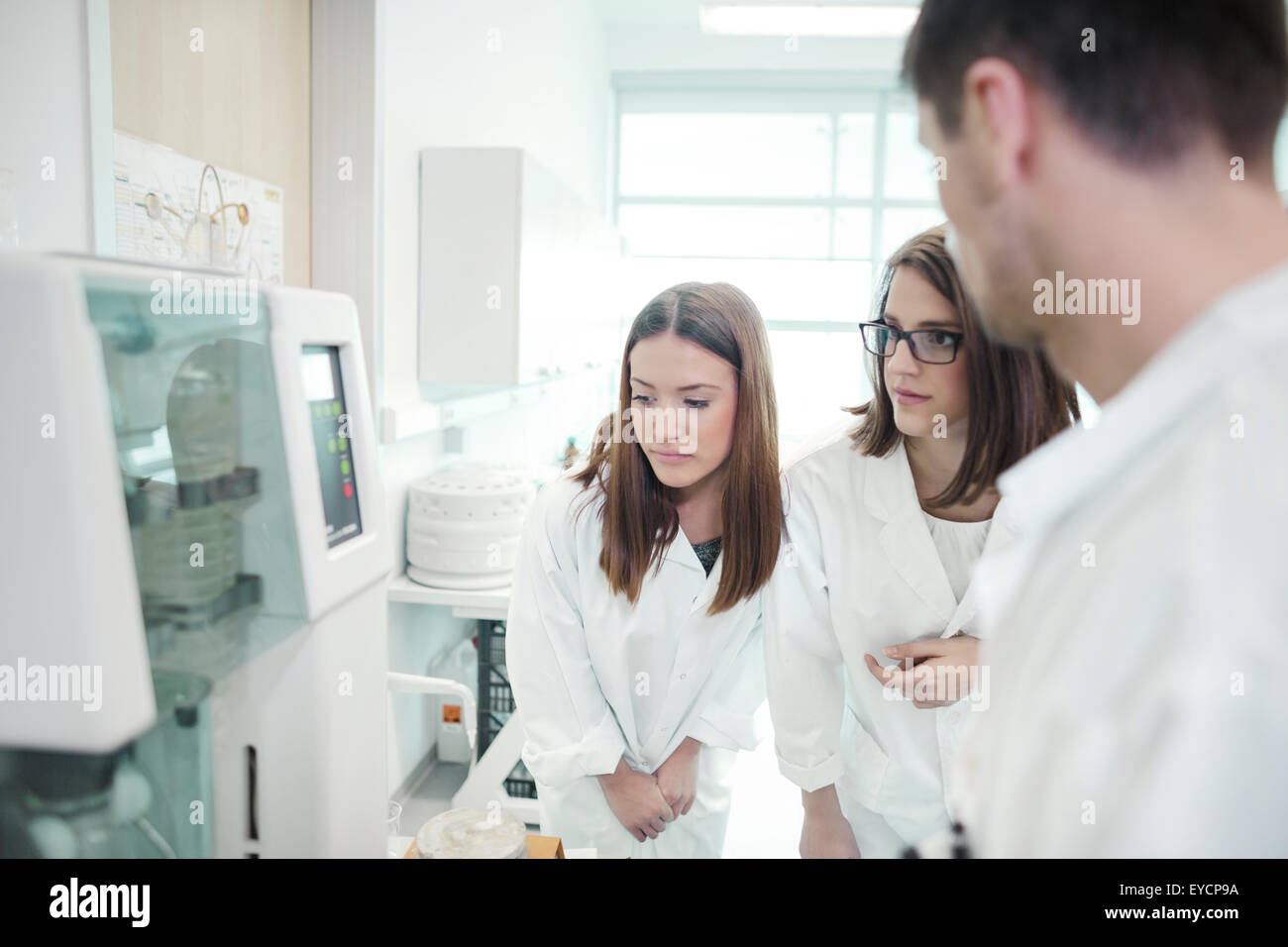 Scientists working in lab Stock Photo - Alamy