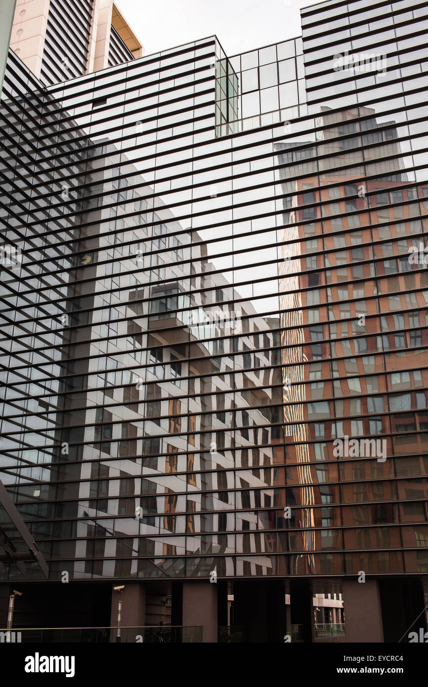 Austria, Vienna, reflections of buildings on glass facade Stock Photo ...