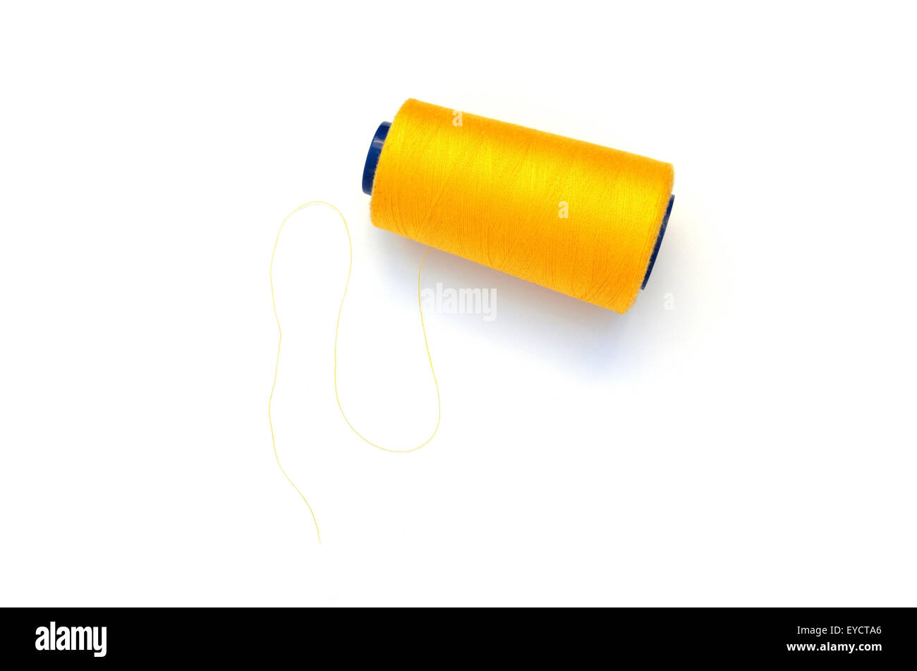 Yellow tiny thread put on white background Stock Photo - Alamy