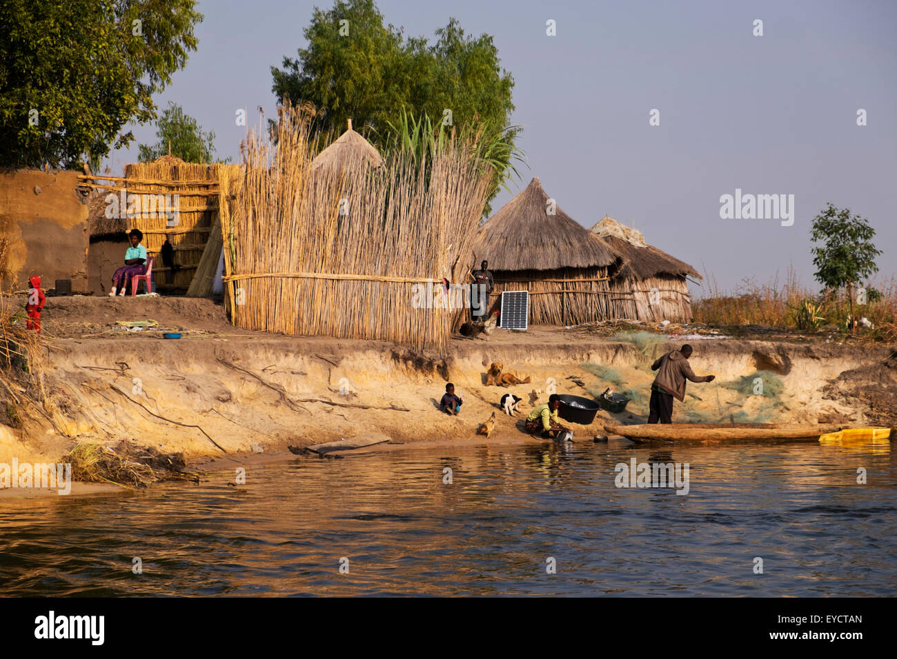 African grass huts show typical village life on the Zambezi river Stock ...